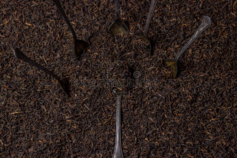 Teaspoons Sticking Out of a Pile of Loose Tea Stock Image - Image of ...