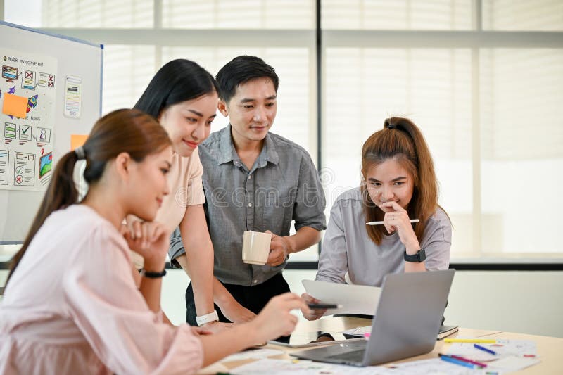 A Group of Professional Asian Tech Developers is in the Meeting ...