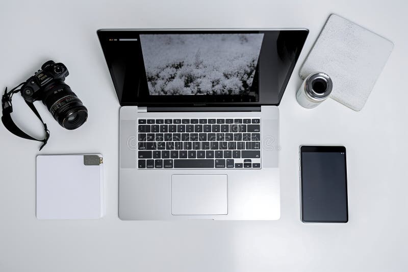 Tech Enthusiast S Workspace: an Aerial View of a Laptop and Camera on a ...