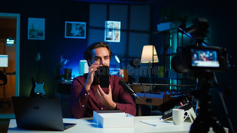 Tech Guru Assessing Smartphone Performance Stock Photo - Image of host ...