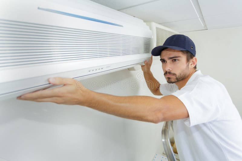 Tech Guy Carefully Installing New Ac Stock Photo - Image of ...
