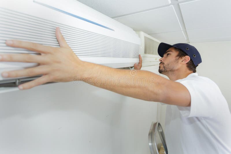 Tech Guy Carefully Installing New Ac Stock Photo - Image of house ...