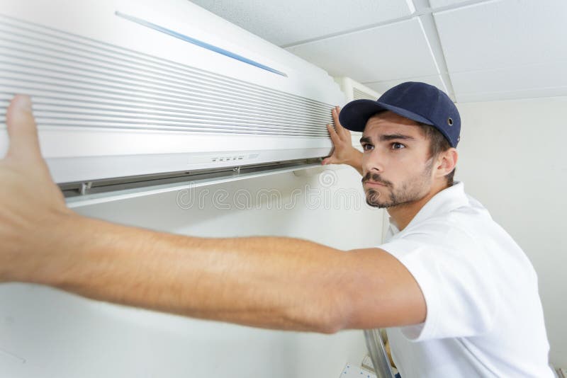 Tech Guy Carefully Installing New Ac Stock Image - Image of cold ...