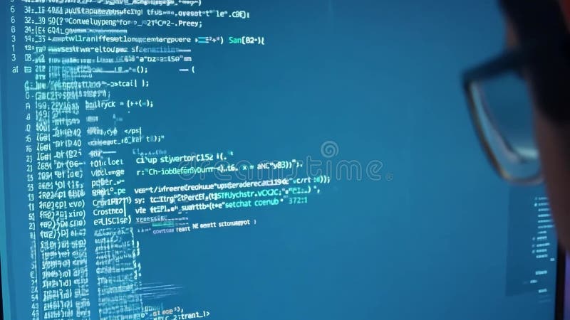 Tech Professional Reviewing Code on Computer Screen in Office Setting ...