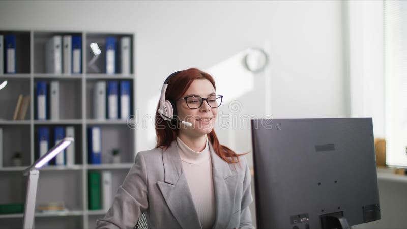 Tech Support, a Young Woman Works in a Call Center and Advises a Client ...