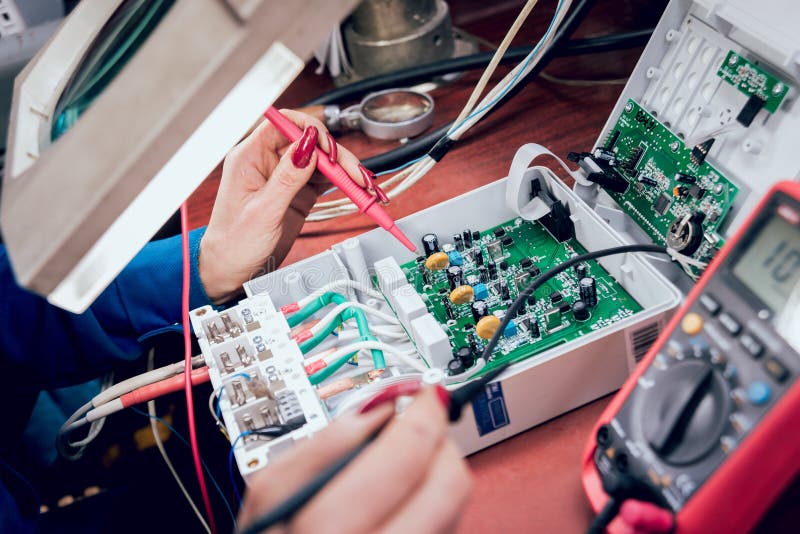 Tech Tests Electronic Equipment in Service Centre Stock Photo - Image ...