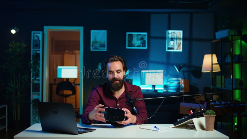 Tech Vlogger Reviewing VR Goggles in Neon Lit Studio Stock Footage ...