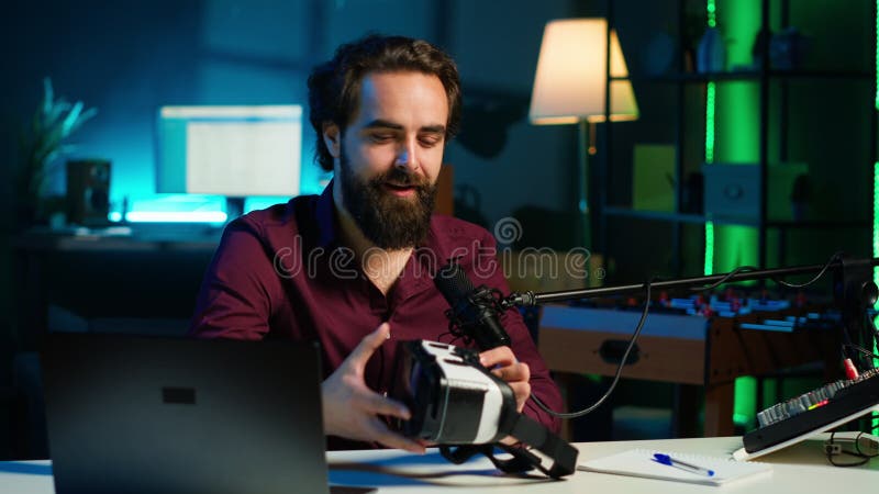 Tech Vlogger Reviewing VR Goggles in Neon Lit Studio Stock Footage ...