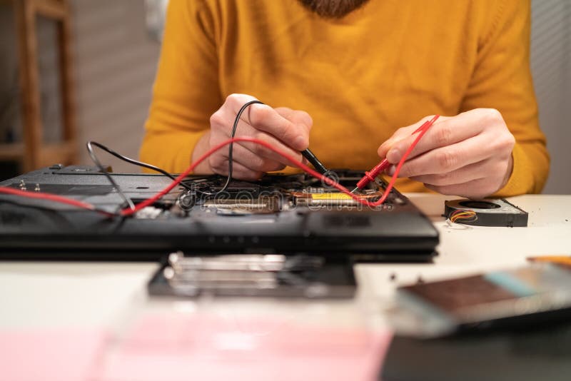 Technical Check Problem for Laptop Computer with Multimeter in Repair ...