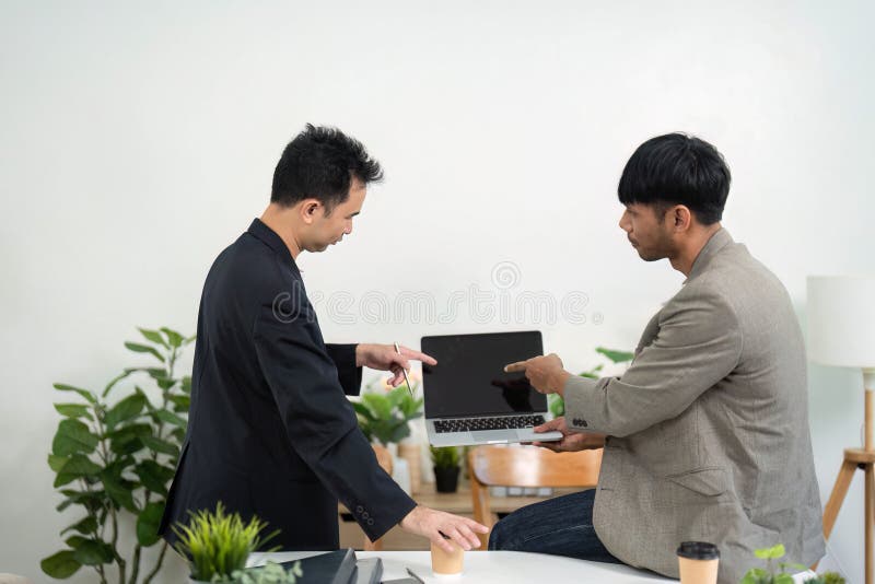 Technical Discussion and Problem Solving. Colleagues Analyzing a Laptop ...
