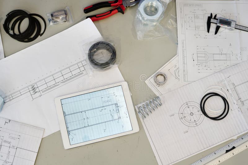 Technical Drawings and Digital Tablet on Table Stock Photo - Image of ...
