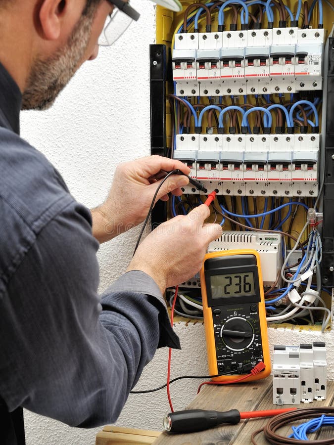 Electrician Technician at Work with Protective Helmet on a Residential ...