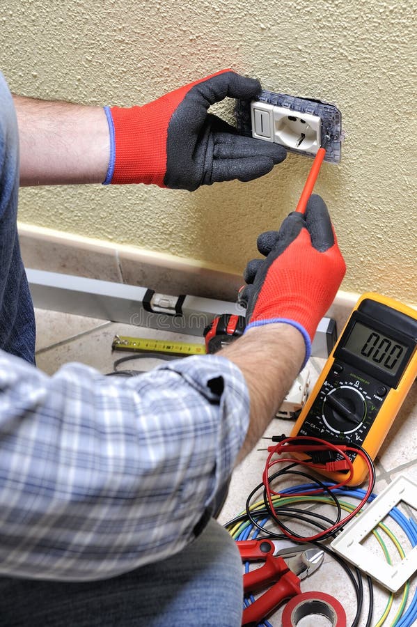 Electrician Technician at Work with Safety Equipment on a Residential ...