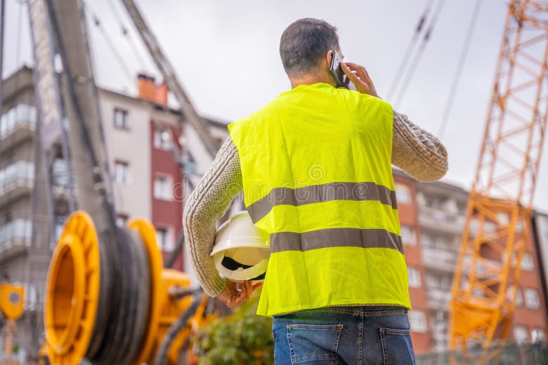 Technical Engineer at the City Site while Having a Phone Call Stock ...