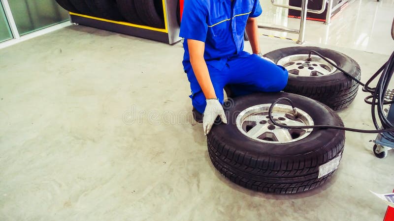 Technical during Tire Assembler in Tire Service Center Stock Image ...