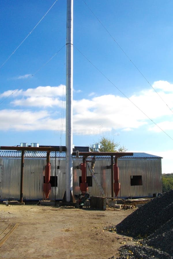 Technical Industrial Building with a Long Pipe. View Outside on a ...