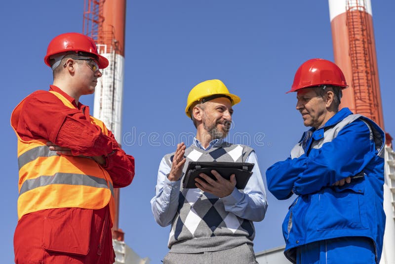 Technical Manager Using Digital Tablet and Discussing about Production ...