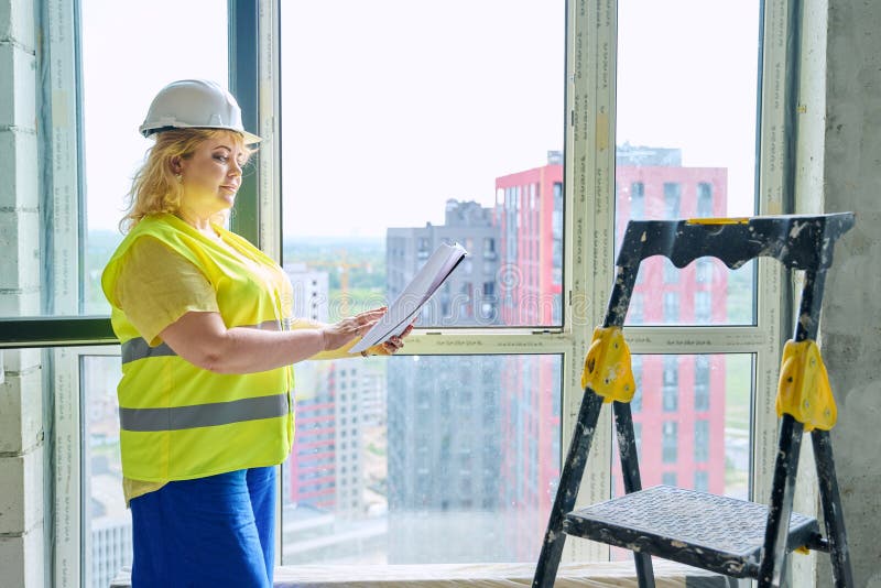 Technical Profession Woman in Protective Vest Helmet Working on ...