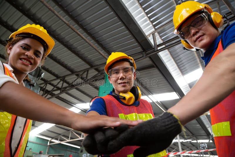 Technical Specialist Engineer Putting Their Hands Together. Stack of ...