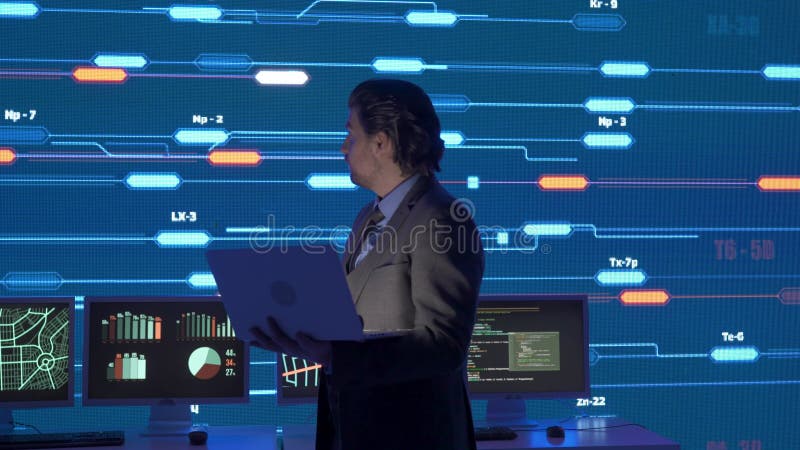 Technical Support in Control Room. Man it Specialist with Laptop at ...