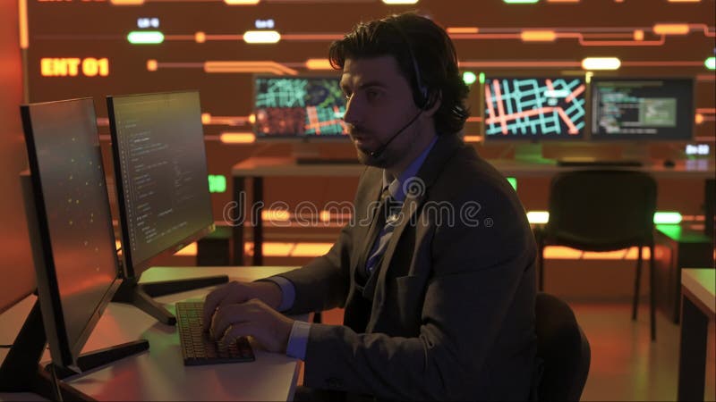 Technical Support in Control Room. Man it Specialist Works on Computer ...