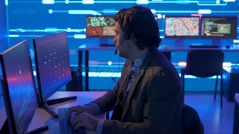 Technical Support in Control Room. Man it Specialist Works on Computer ...