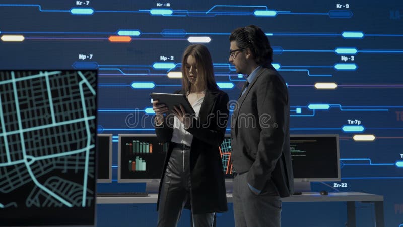 Technical Support in Control Room. it Specialists Talking at the ...