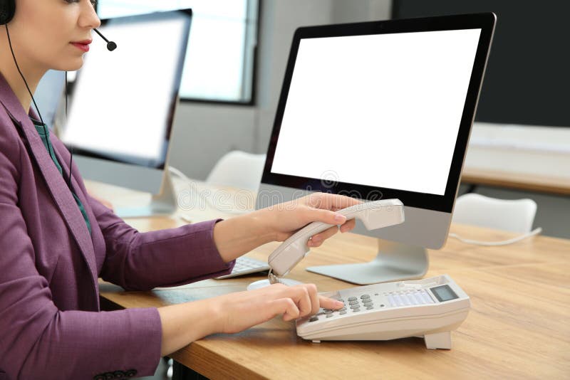 Technical Support Operator Dialing Number on Telephone at Table, Stock ...