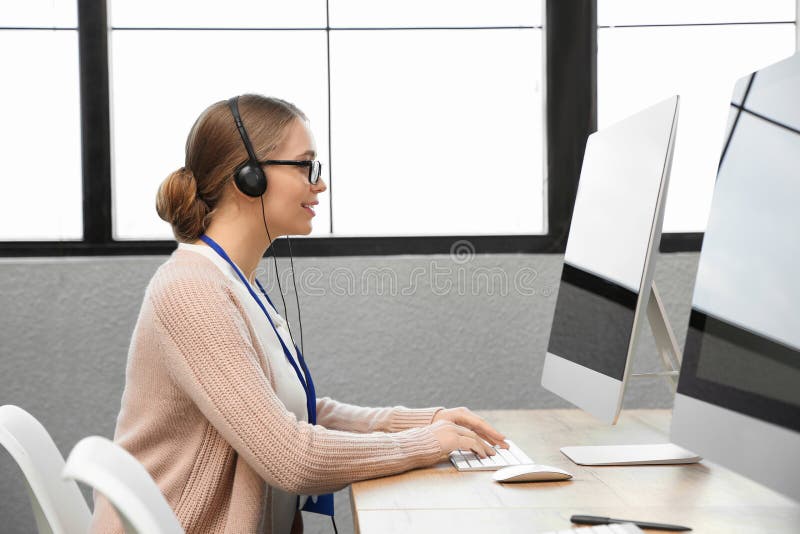 Technical Support Operator Working with Computer at Table Stock Image ...