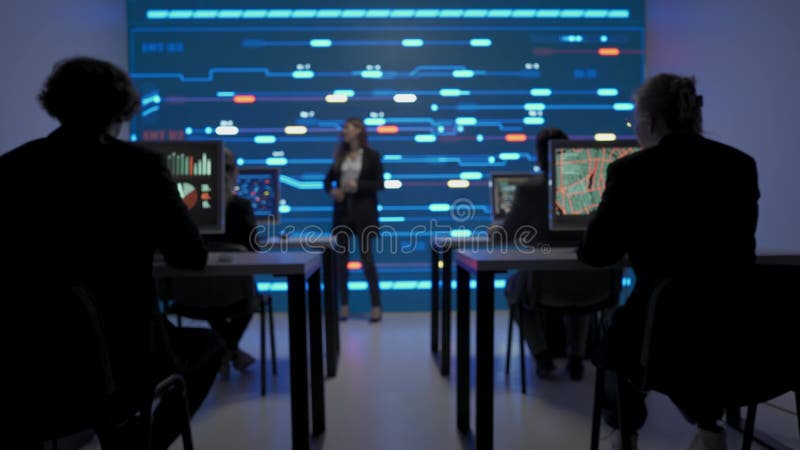 Technical Support Team in Control Room. Woman Leader Specialist Talking ...