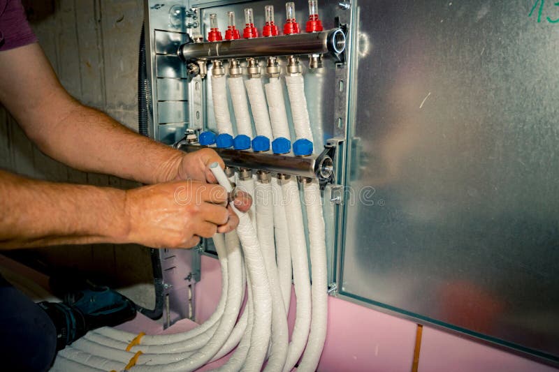 Technician is Adjust Distribution and Control Panel of Heat Pump ...