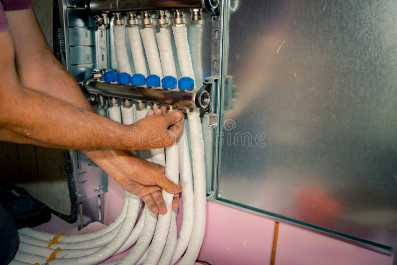 Technician is Adjust Distribution and Control Panel of Heat Pump ...