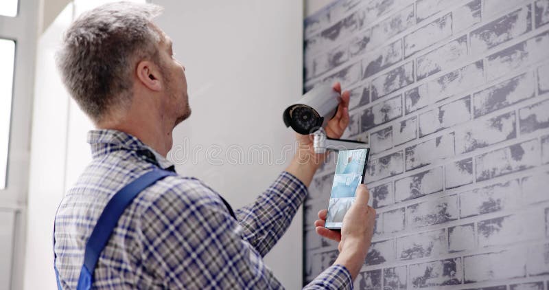 Technician Adjusting CCTV stock photo. Image of engineer - 275792202