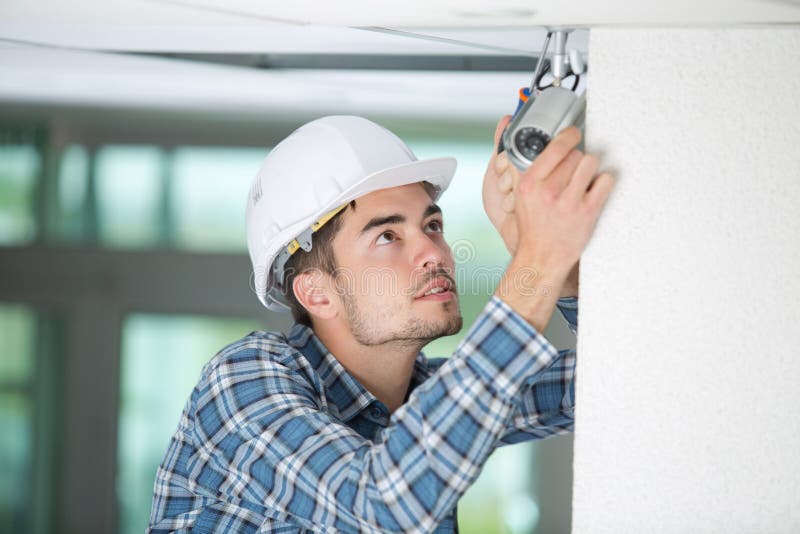 Technician Adjusting Cctv Camera on Wall Stock Photo - Image of safety ...