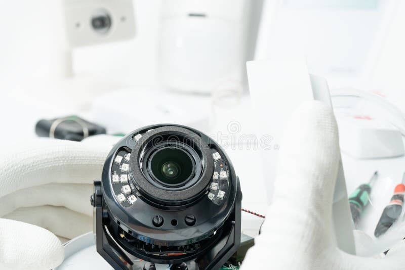 Technician Adjusting Security Camera before Installation Wearing White ...