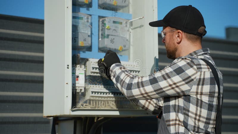 Technician Adjusting Wires in Power Meter Panel Stock Video - Video of ...