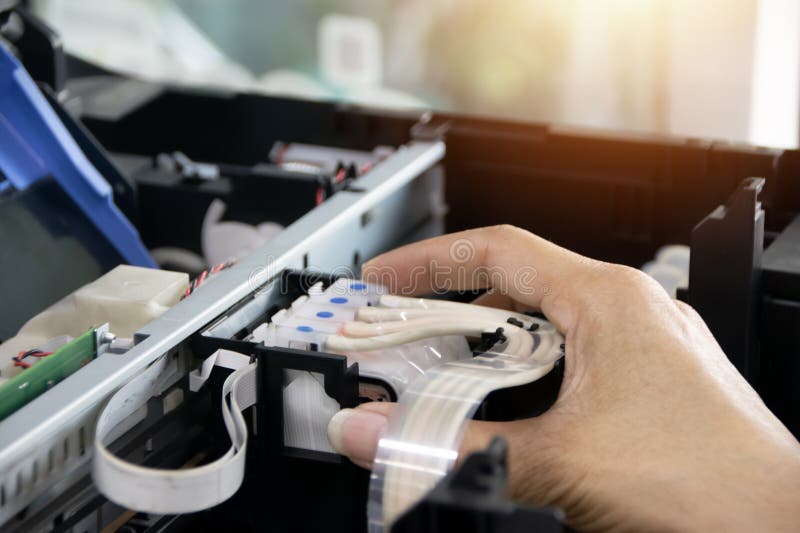 The Technician is Aligning the Print Head and Repairing the Printer ...