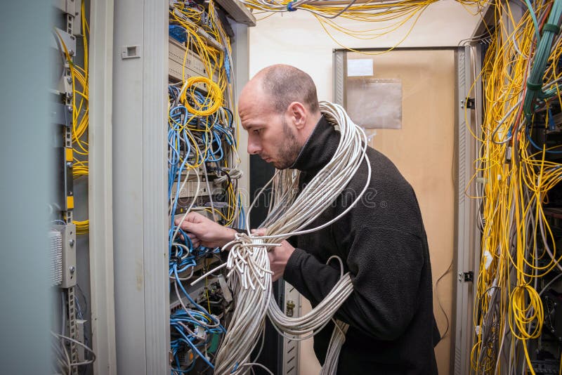 Man wrapped in cables. stock photo. Image of colour, person - 2425862