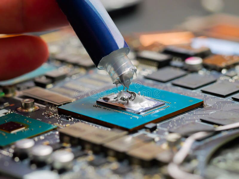 Technician Applying Thermal Paste To a GPU on Laptop Motherboard. Stock ...