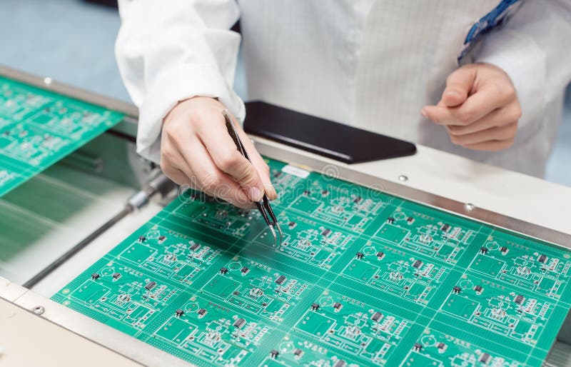 Technician Assembling Electronic Product by Inserting Components into ...