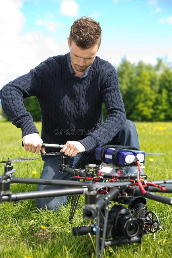 Engineers Operating UAV Helicopter Stock Photo - Image of feed ...