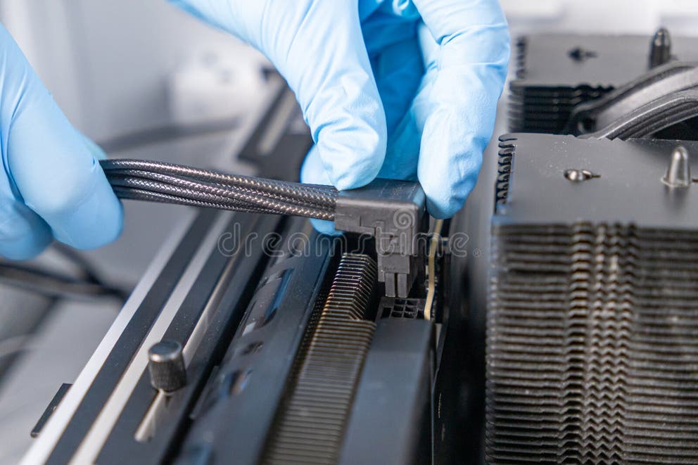 Technician in Blue Gloves Connecting 16-pin Power Cable To Modern GPU ...