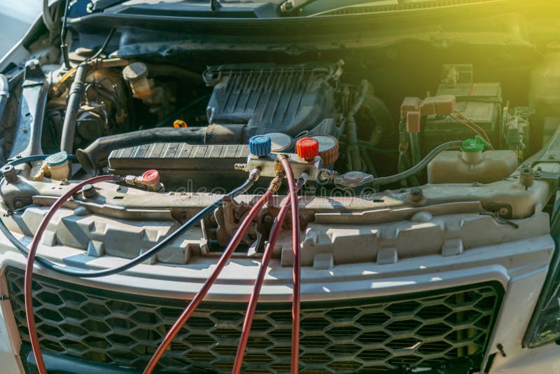 Technician Checking Air Conditioner in Engine Room of Eco Car ...