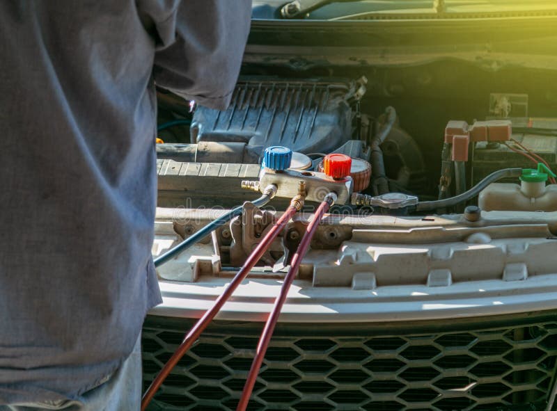 Technician Checking Air Conditioner in Engine Room of Eco Car ...