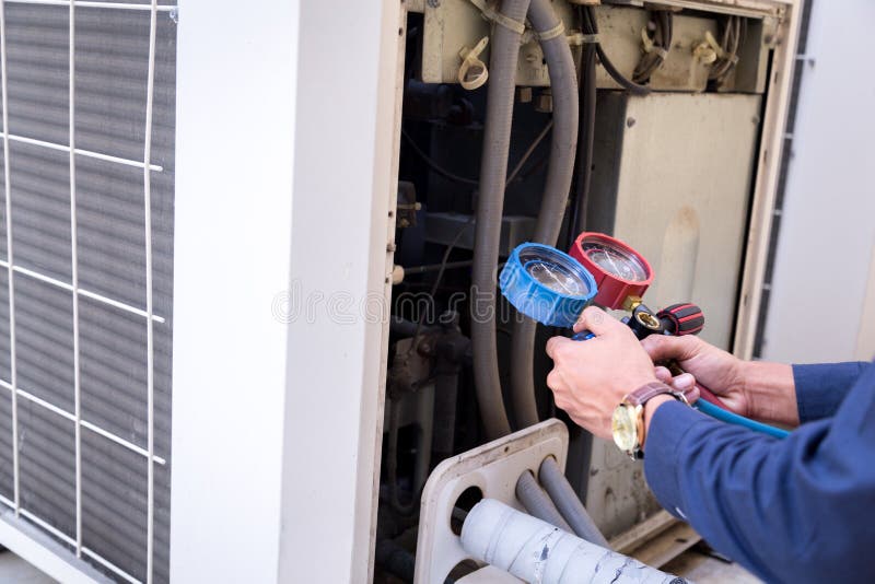 Technician is Checking Air Conditioner ,measuring Equipment for Filling ...