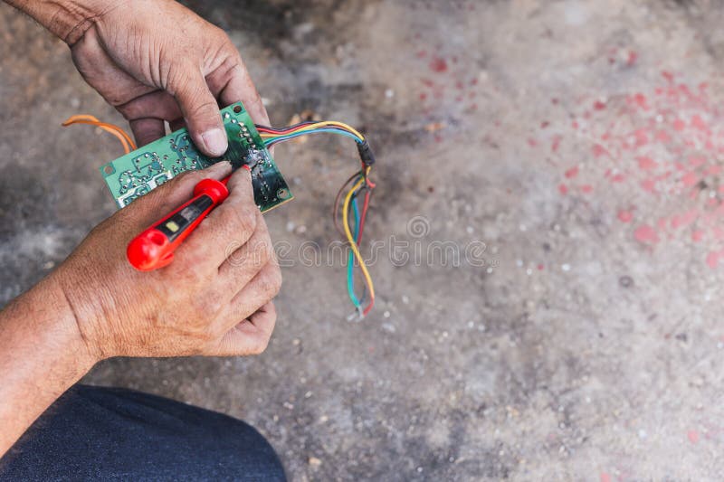 Technician is Checking Back Side Remote Control Motherboard. Stock ...