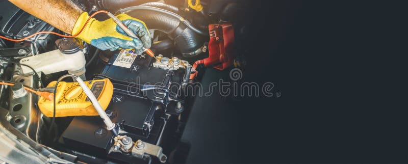 A Technician Checking DC Voltage Stable of the Car Battery with Digital ...