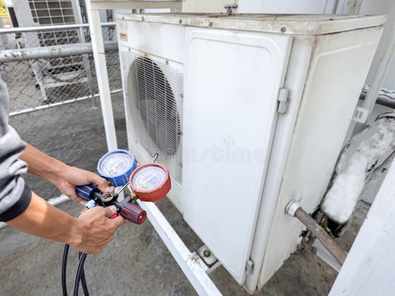 Technician Checking the Operation of the Air Conditioner Stock Photo ...