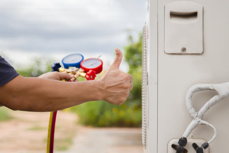 Air Conditioning, HVAC Service Technician Using Gauges To Check ...
