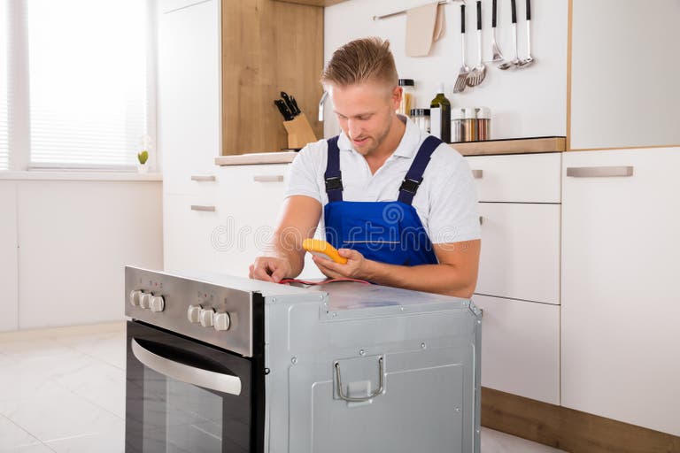 Technician Checking Oven with Digital Multimeter Stock Image - Image of ...